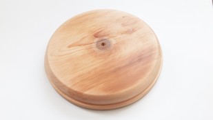 Large round softwood pattress , manufactured from pine